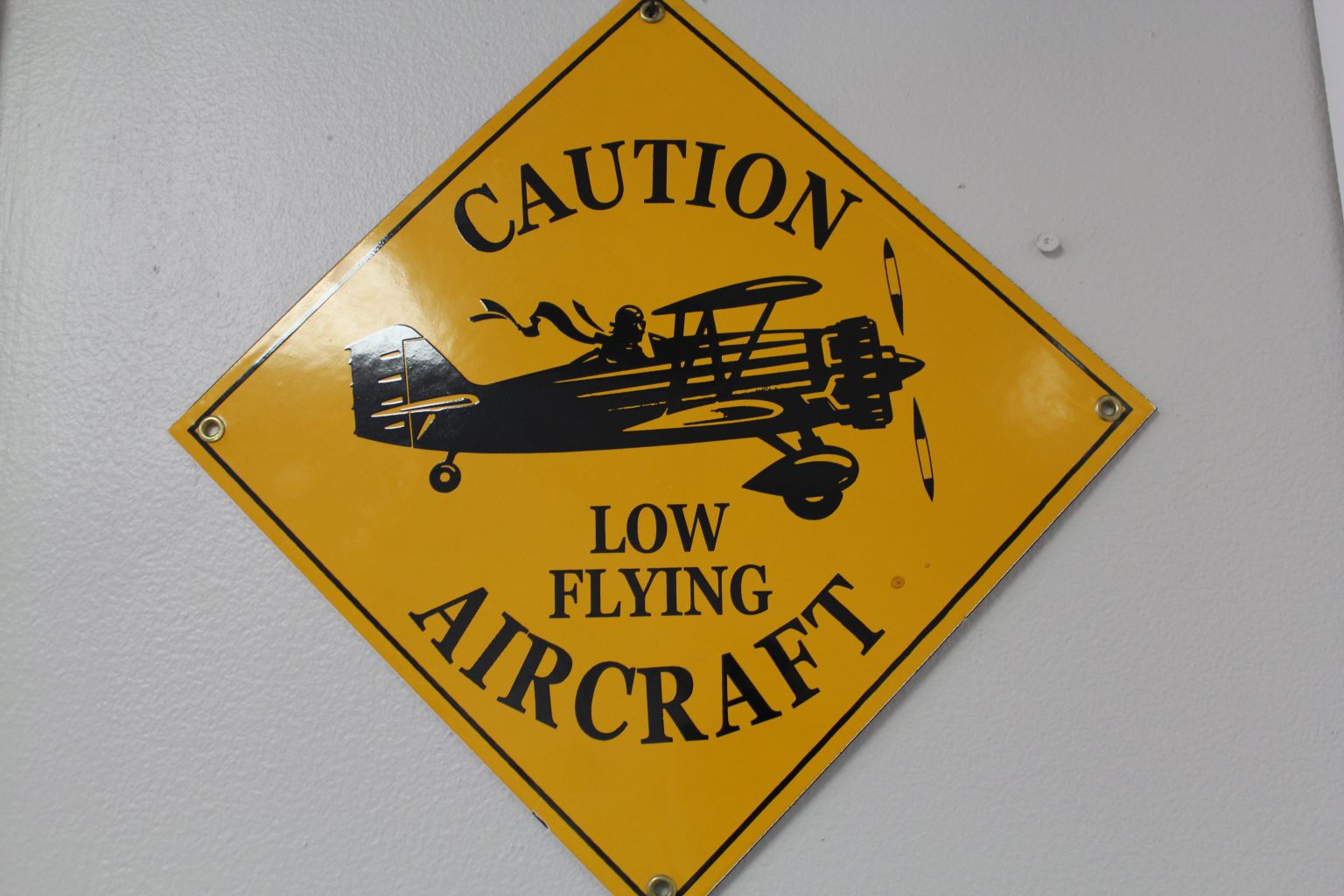 Metal Sign “Caution Low Flying” | Illinois Aviation Academy